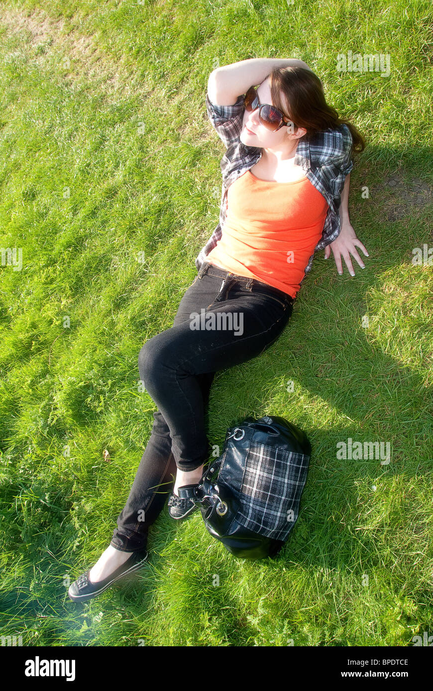 female model relaxing in the sun Stock Photo - Alamy