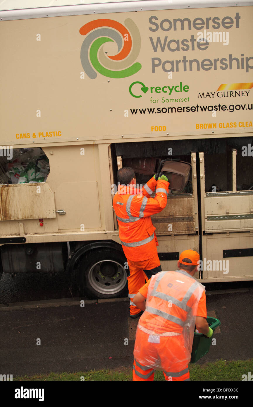 August 2010 - Refuse recycling truck and crew in action on a wet day in ...