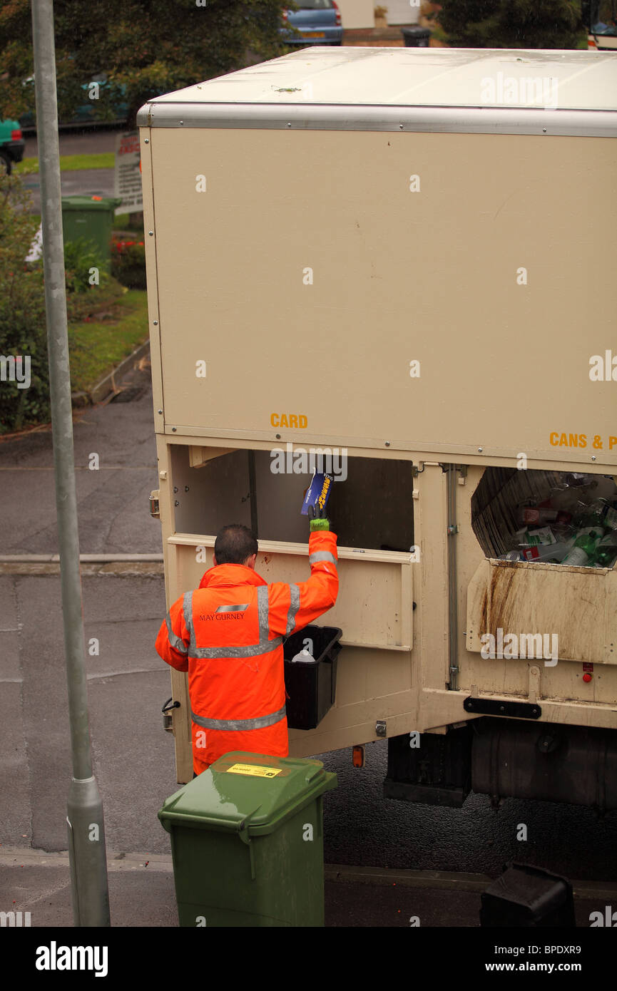 August 2010 - Refuse recycling truck and crew in action on a wet day in ...
