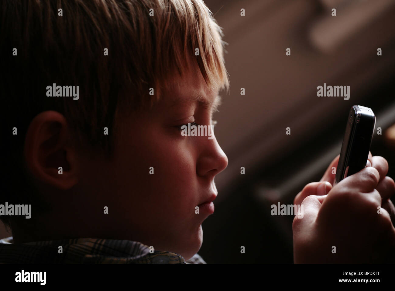 boy using phone Stock Photo - Alamy