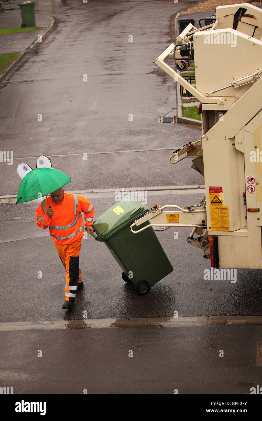 August 2010 - Refuse recycling truck and crew in action on a wet day in ...