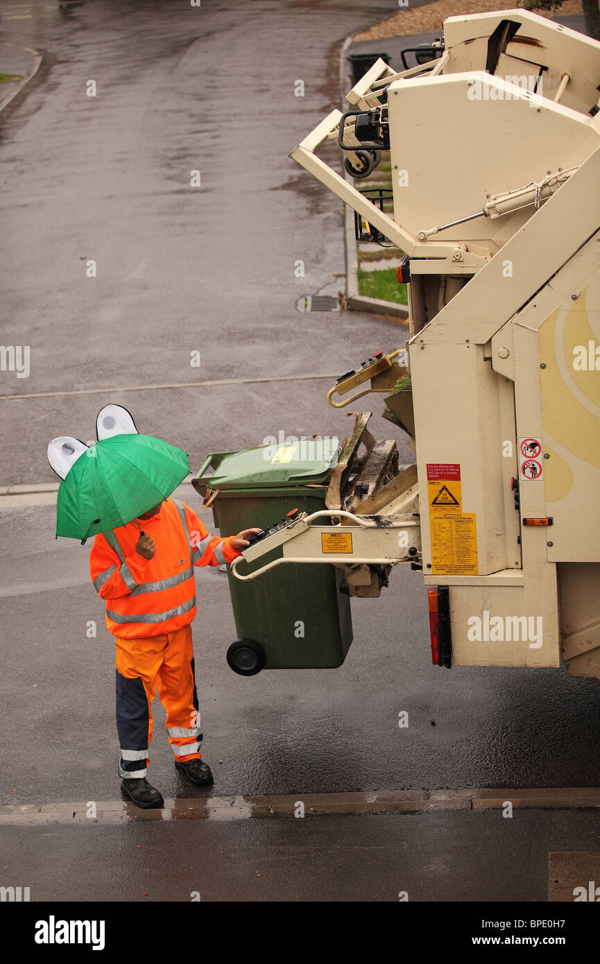 August 2010 - Refuse recycling truck and crew in action on a wet day in ...
