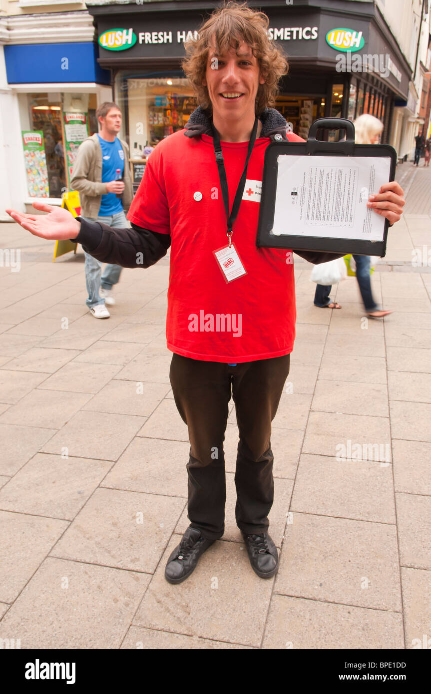 A British Red Cross charity worker in the city centre of Norwich ...