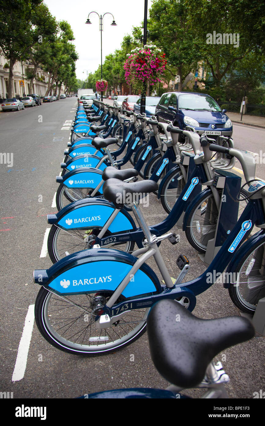 Hire bike docking station on Queen's Gate, South Kensington. Part of ...
