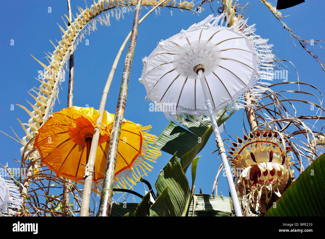 traditional temple decorations against a blue sky kuta bali Stock Photo ...