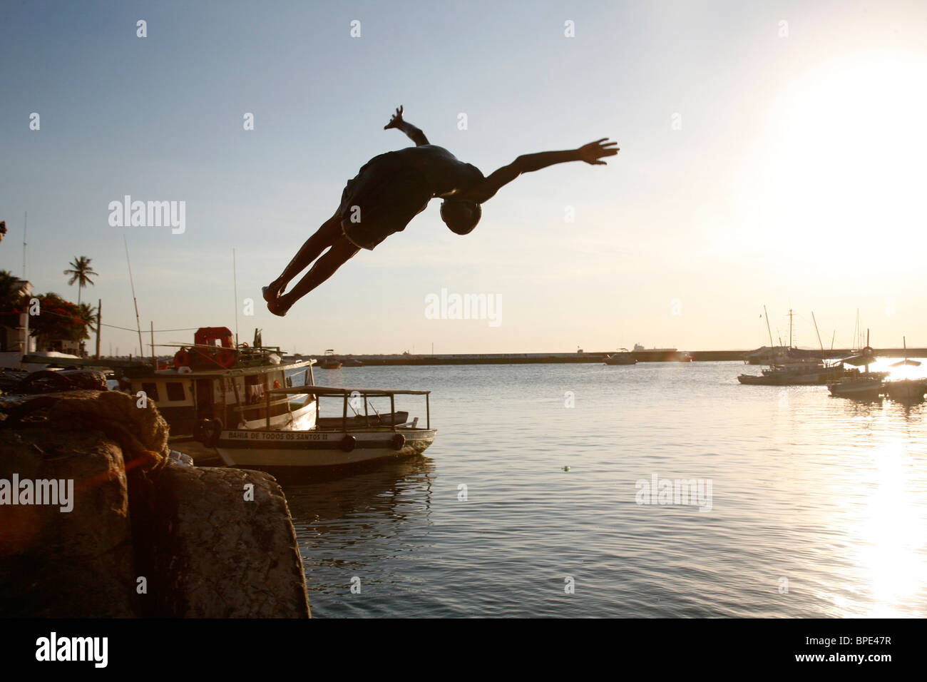 Boy jumps water hi-res stock photography and images - Alamy