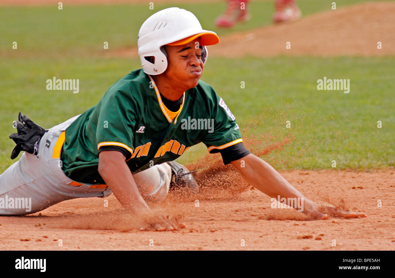 Ray-Patrick Didder of Latin America slides into third base versus U.S ...