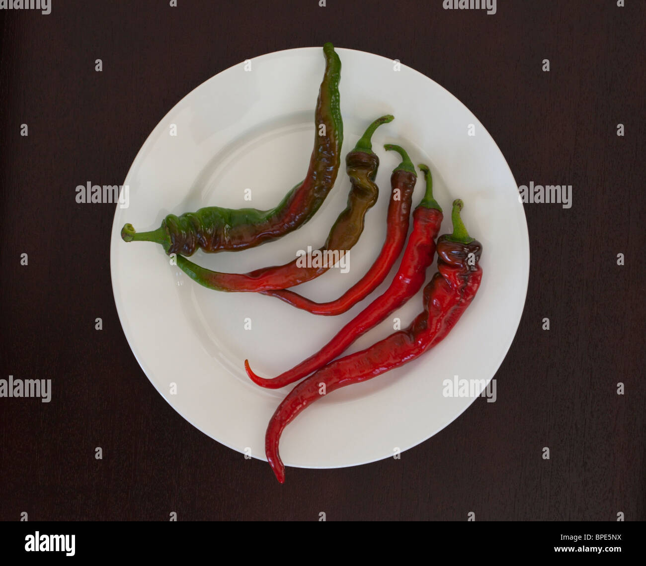 hot chile peppers red portugal white plate Stock Photo - Alamy
