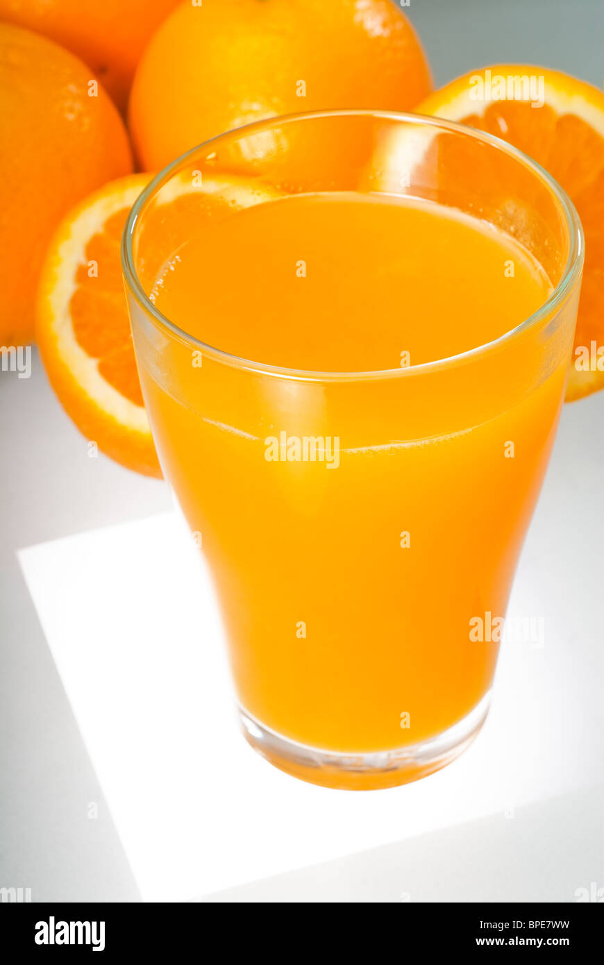 fresh and healthy orange juice ,unfiltered ,over a light table Stock ...