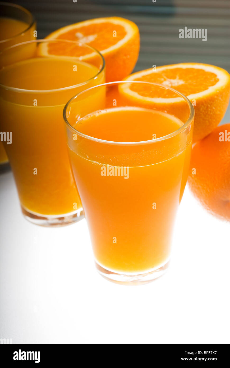 fresh and healthy orange juice ,unfiltered ,over a light table Stock ...