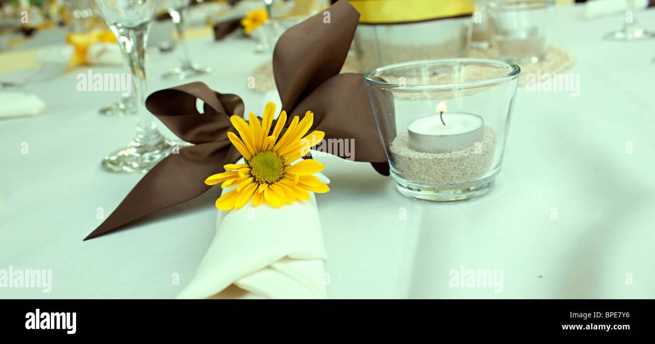 Yellow Daisy table setting with a brown bow Stock Photo - Alamy
