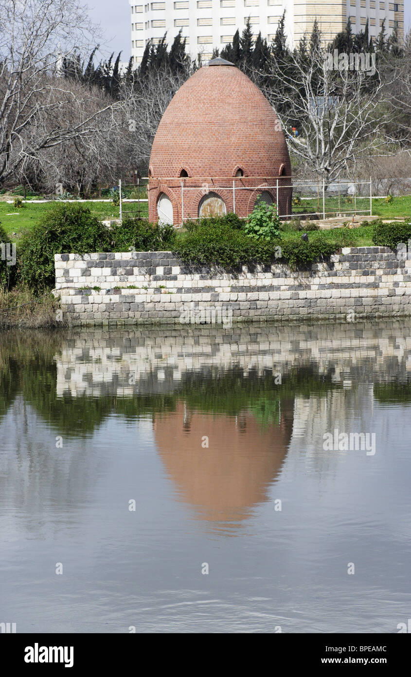 Beehive house on the bank of Orontes river in Hama, Syria Stock Photo ...