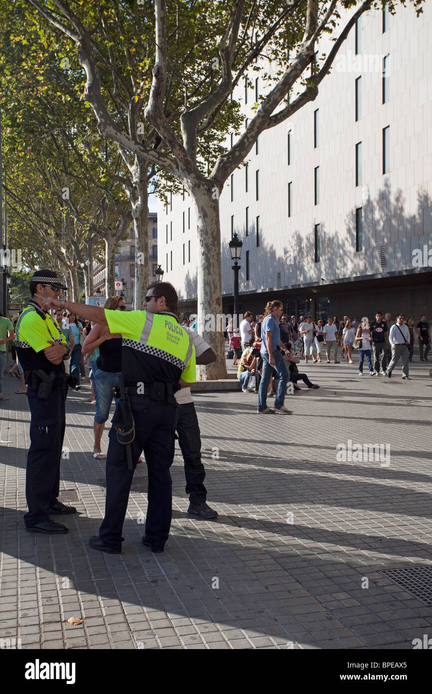 Policemen in street hi-res stock photography and images - Alamy