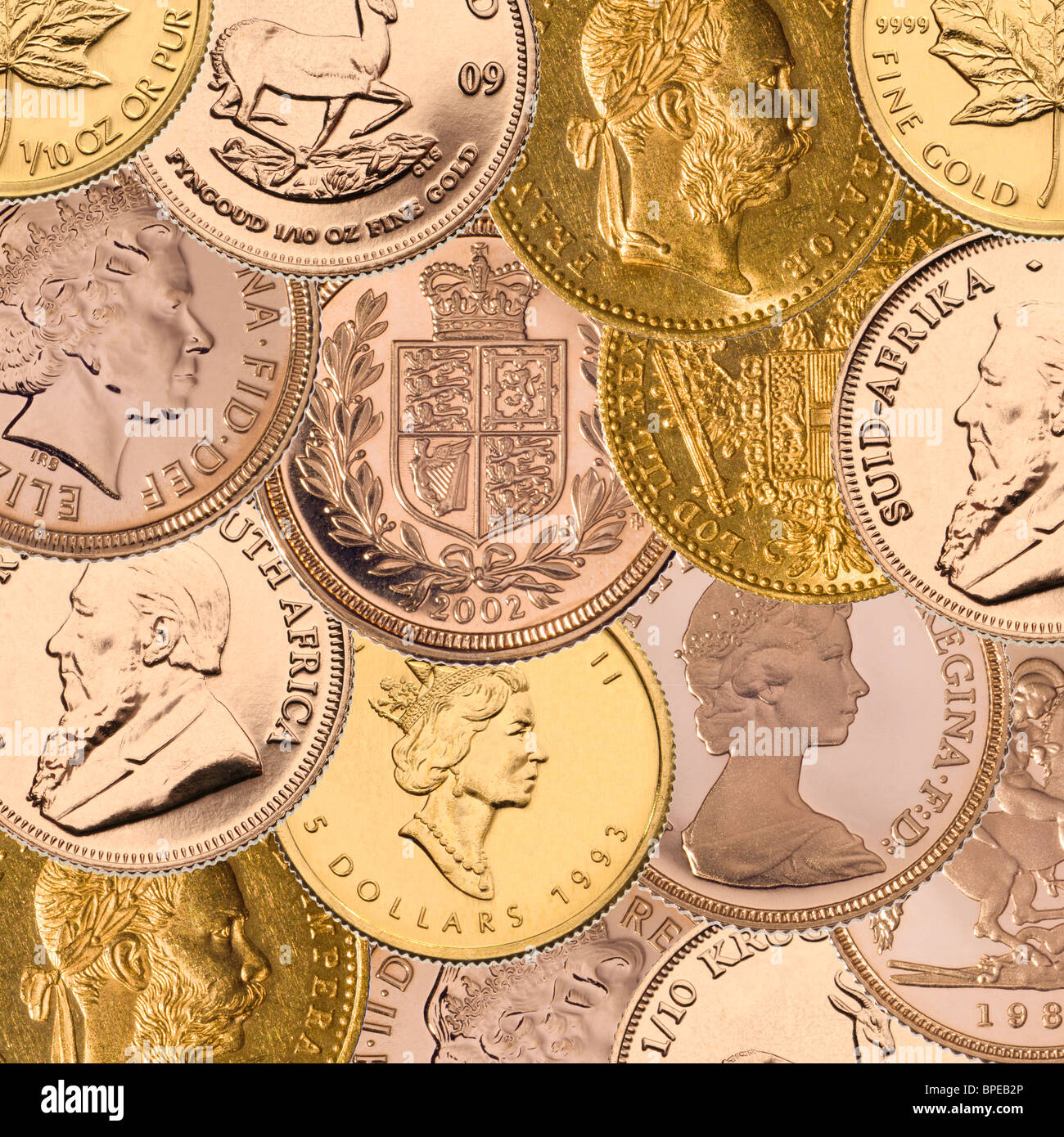 Gold coins, showing differing colours of varying purities Stock Photo ...