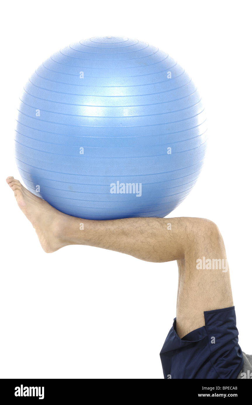 Foot holding exercise ball Stock Photo - Alamy