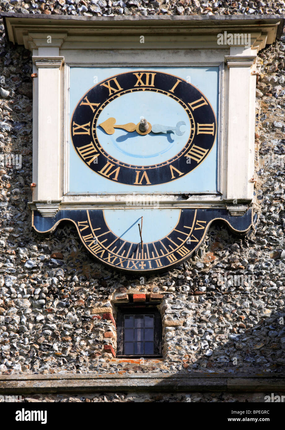 Clock and sundial on the tower of the Church of St Mary the Virgin at ...