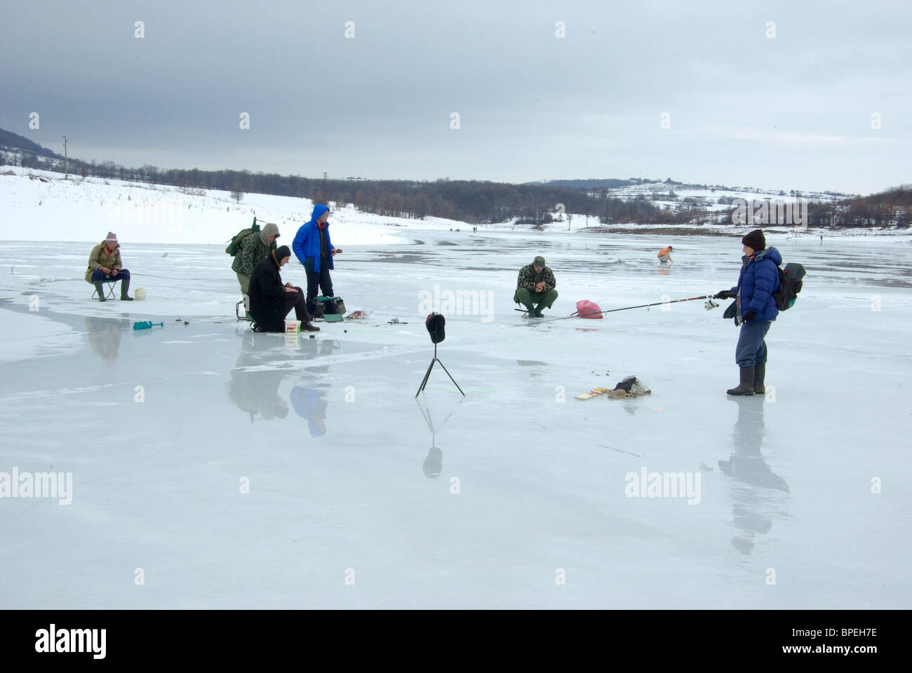 Ice fishing holes hi-res stock photography and images - Alamy