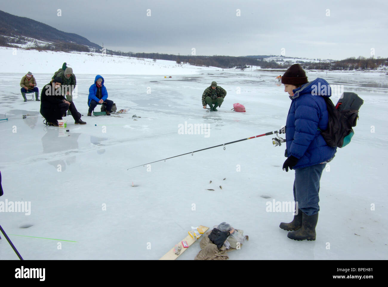 Ice fishing holes hi-res stock photography and images - Alamy