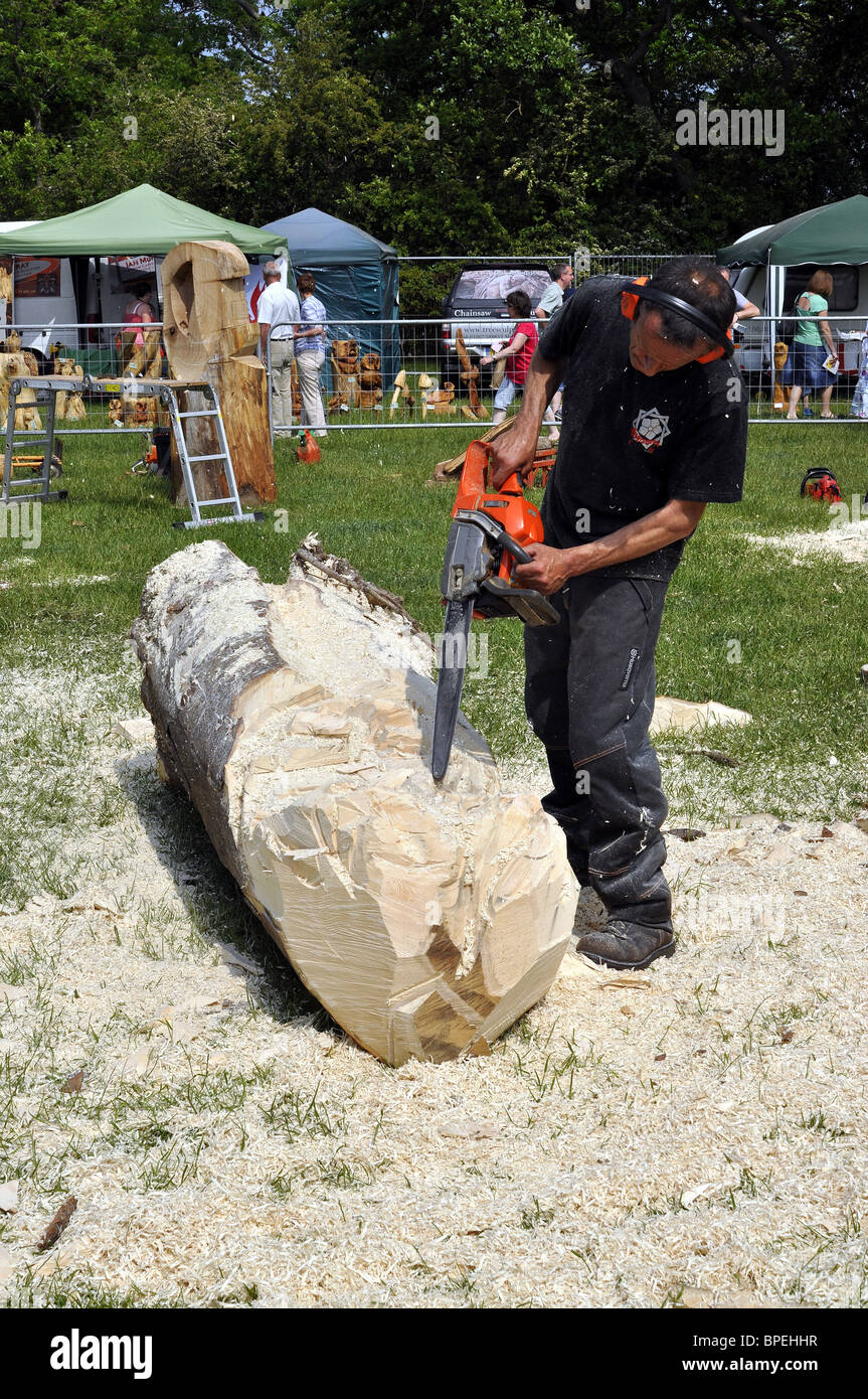 Competitor using a chainsaw in the Woodfest Wood Carving competition St ...