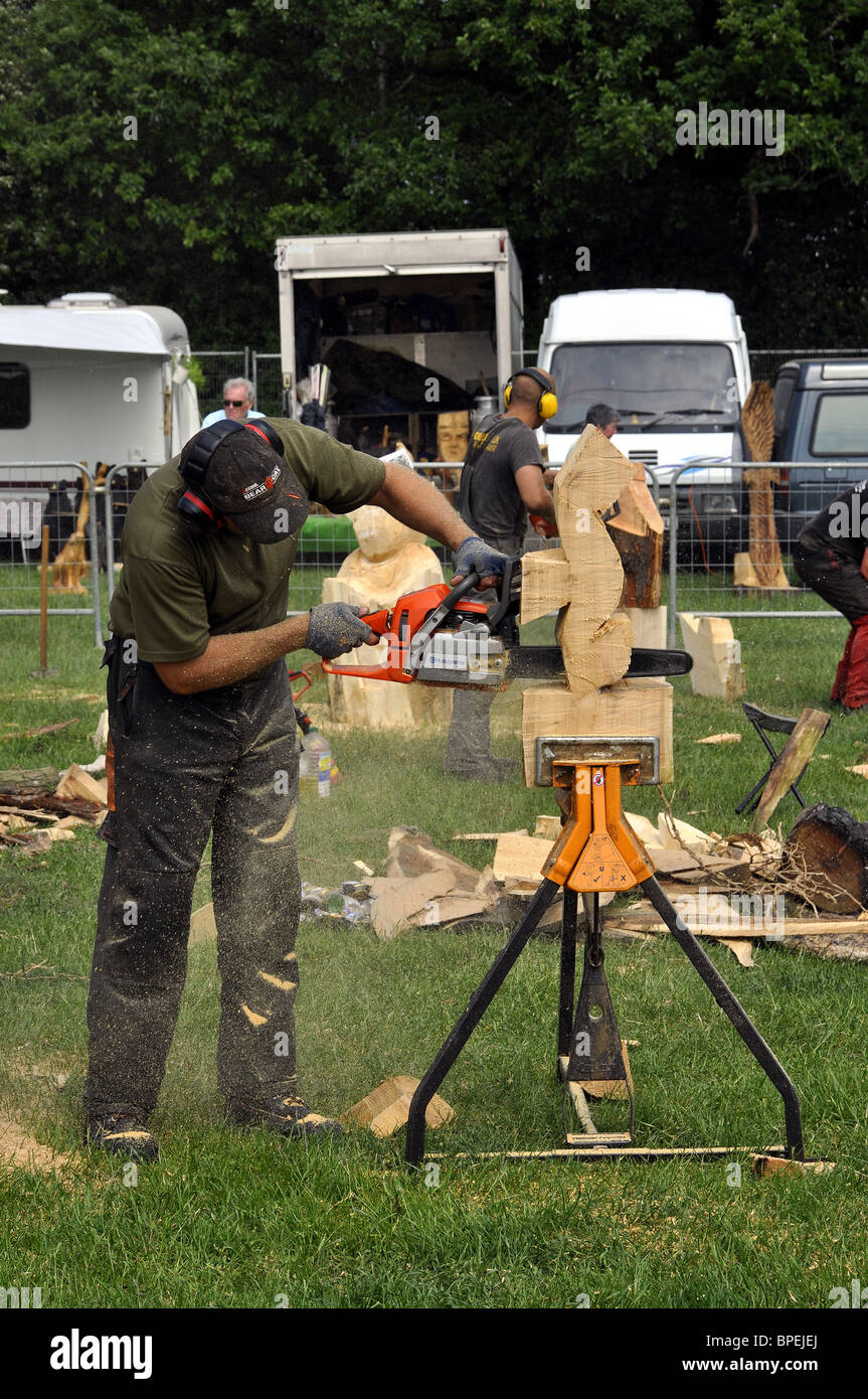 Competitor using a chainsaw in the Woodfest Wood Carving competition St ...