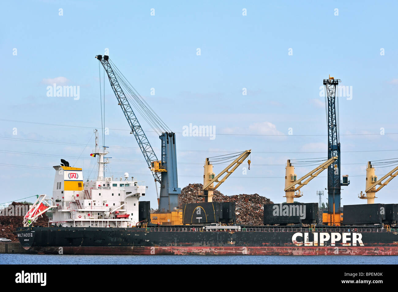 Dock crane loading bulk carrier with recycled scrap metal at Ghent ...