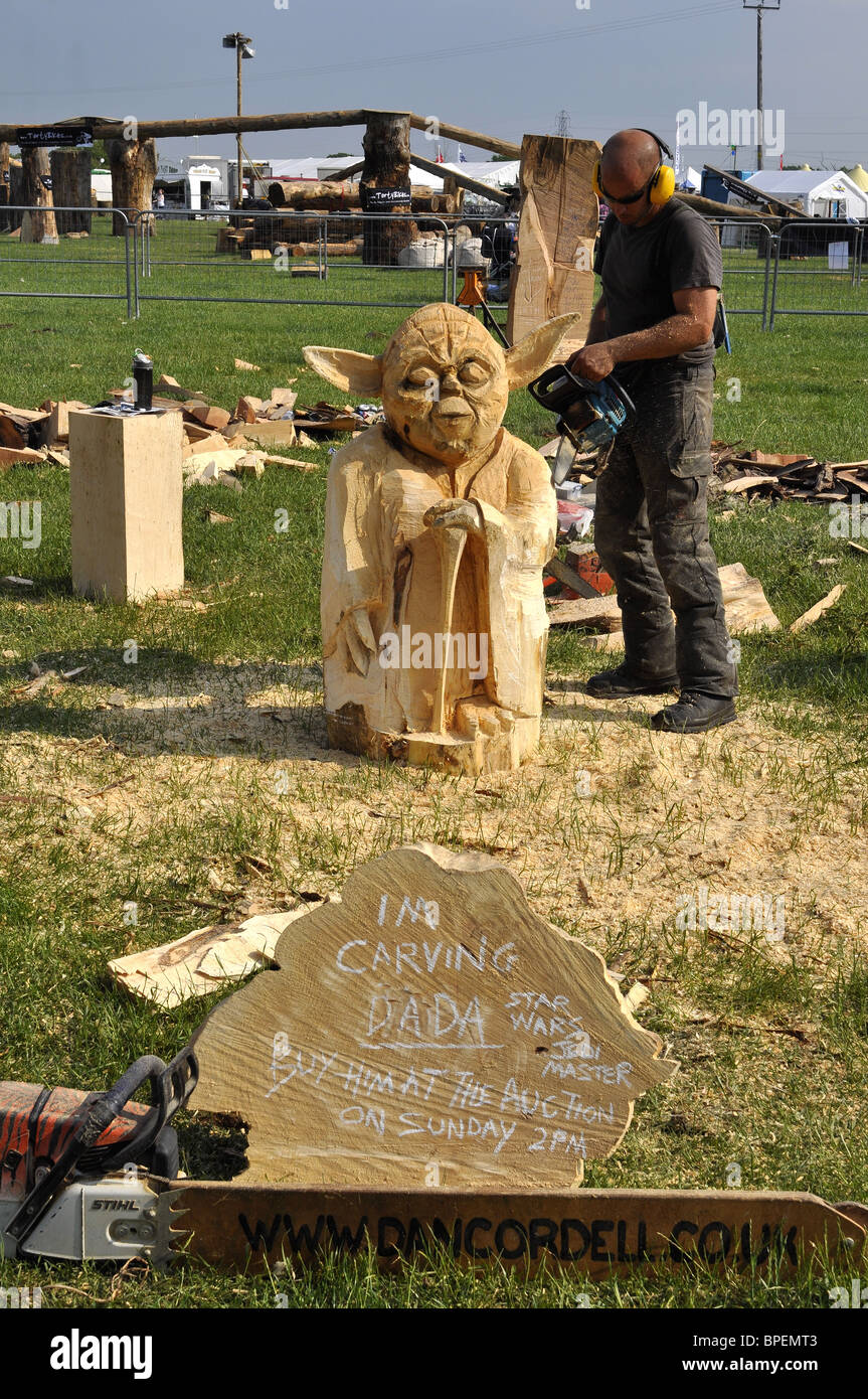 Competitor using a chainsaw in the Woodfest Wood Carving competition St ...