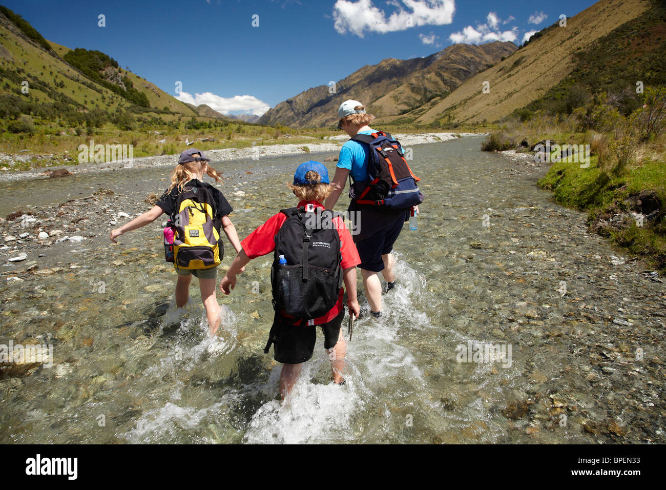 Family of Hikers Crossing Moke Creek, Moonlight Track, near Queenstown ...