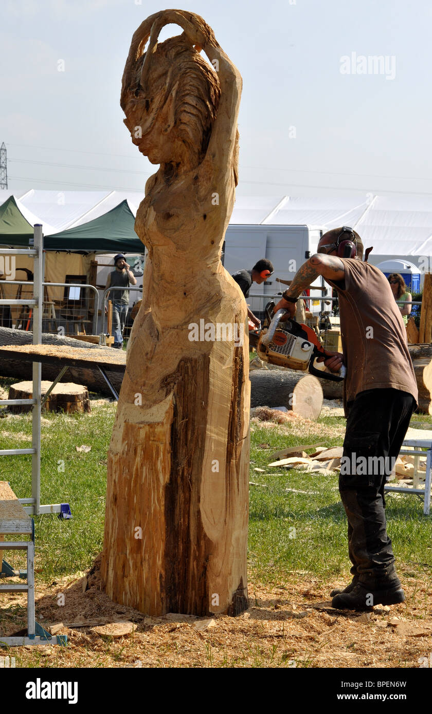 Competitor using a chainsaw in the Woodfest Wood Carving competition St ...