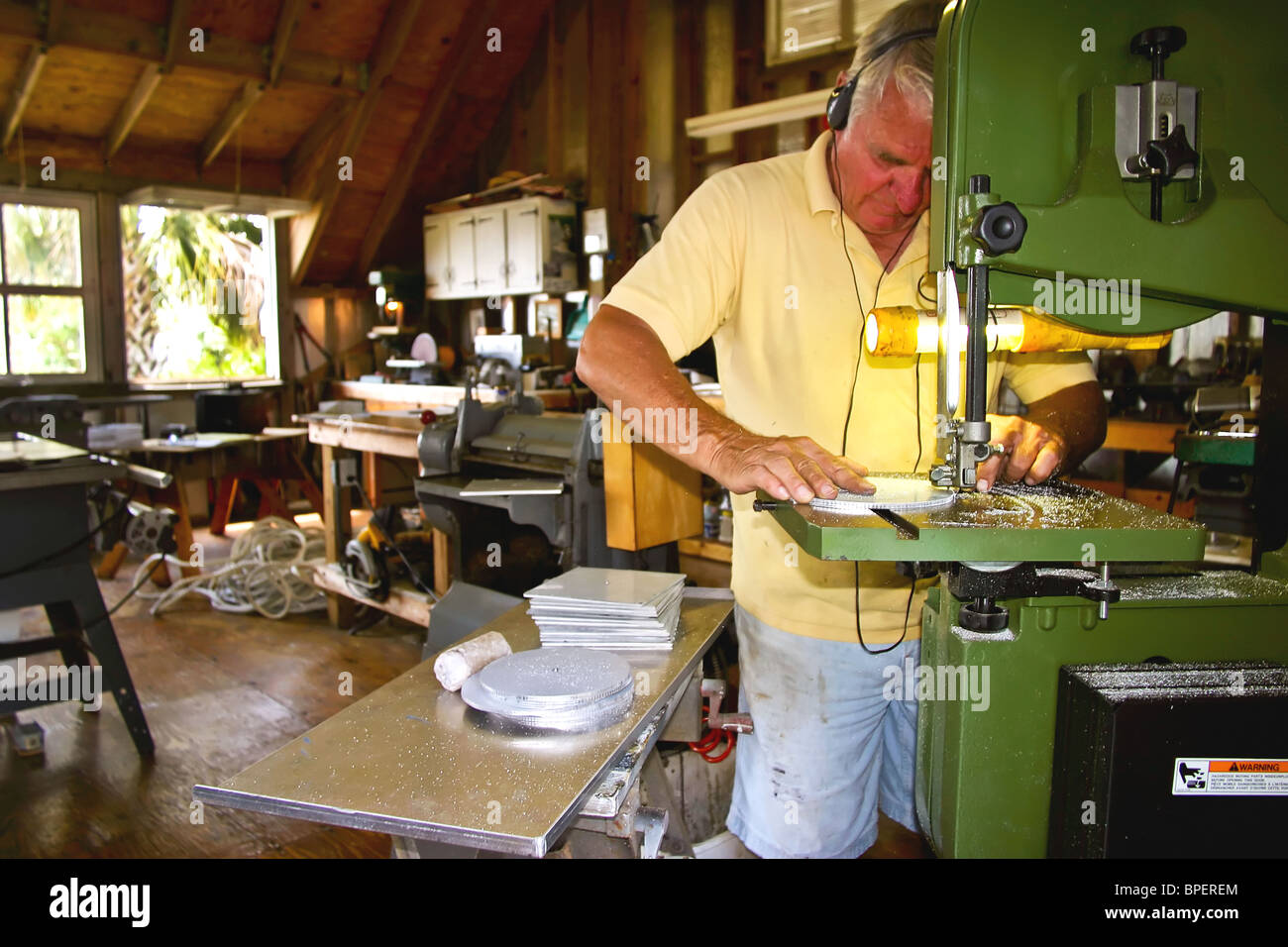 Craftsman metal worker cutting piece hi-res stock photography and ...