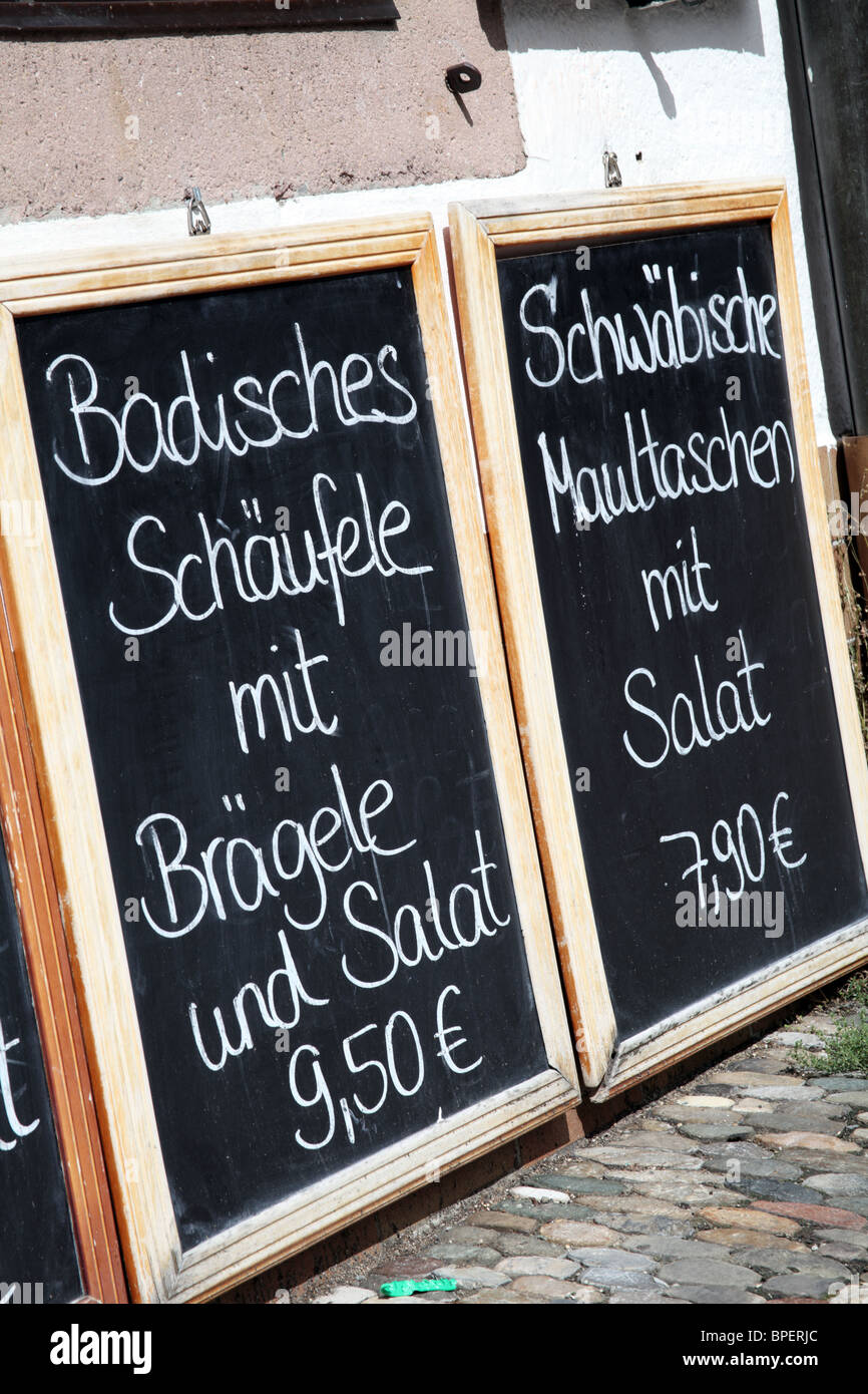 Menu boards outside a restaurant serving traditional Bavarian food ...