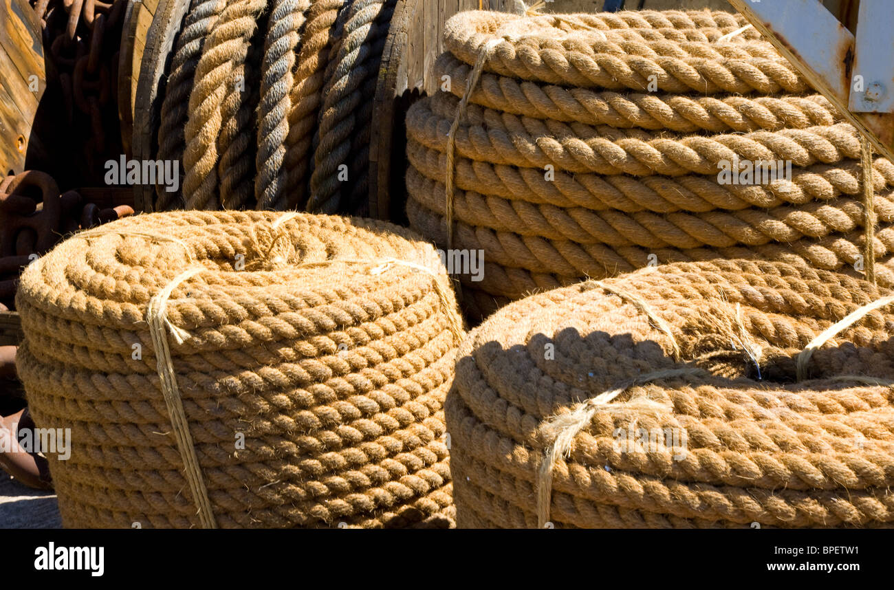 Coils of hemp rope on a harbour quay Stock Photo - Alamy