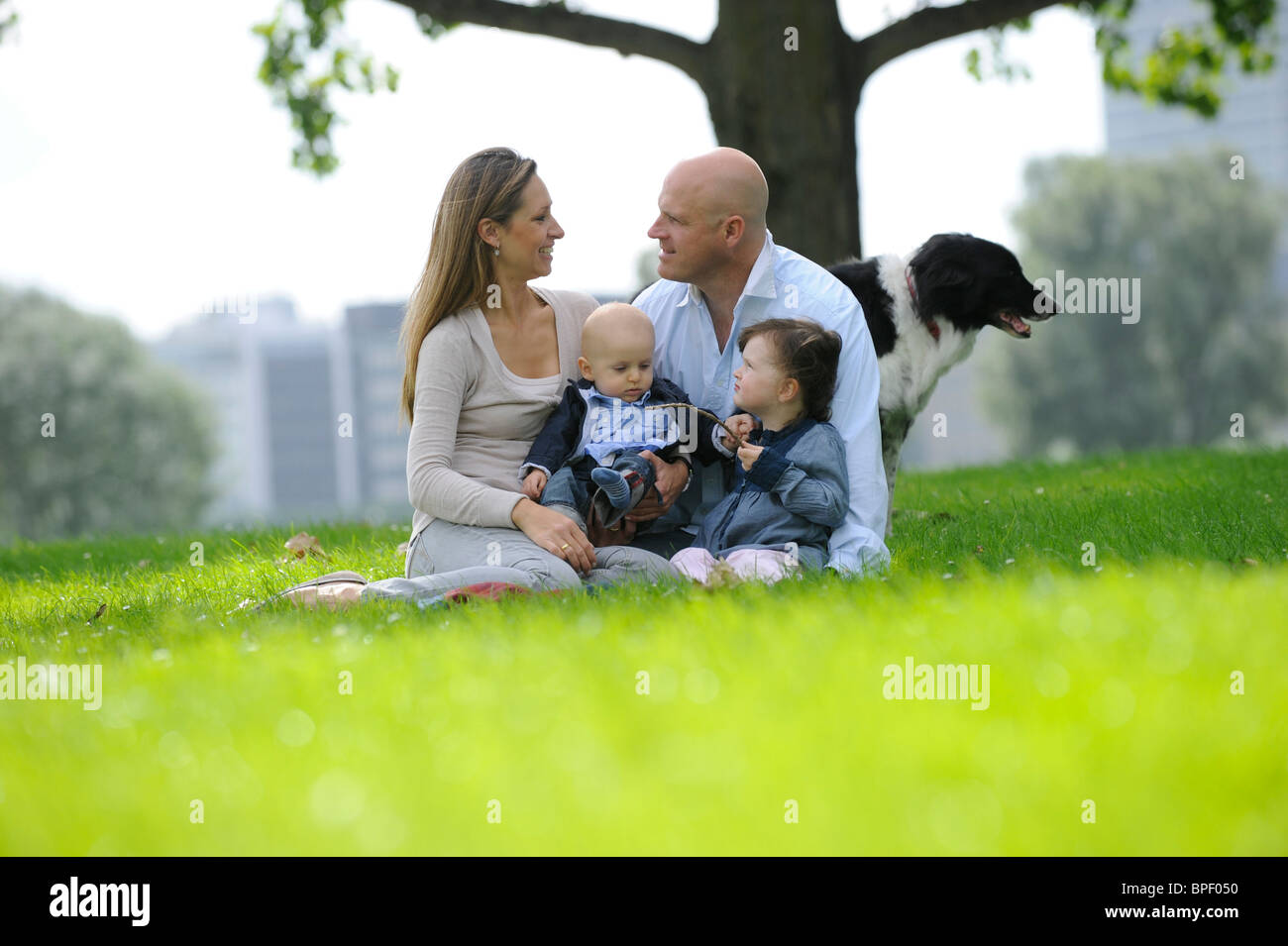 Happy, upper middle class family with two children, a boy and girl ...