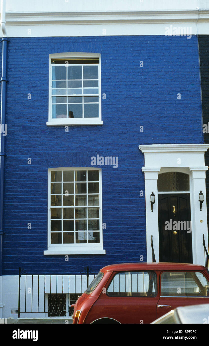 Traditional blue terraced townhouse with white paint-work Stock Photo ...