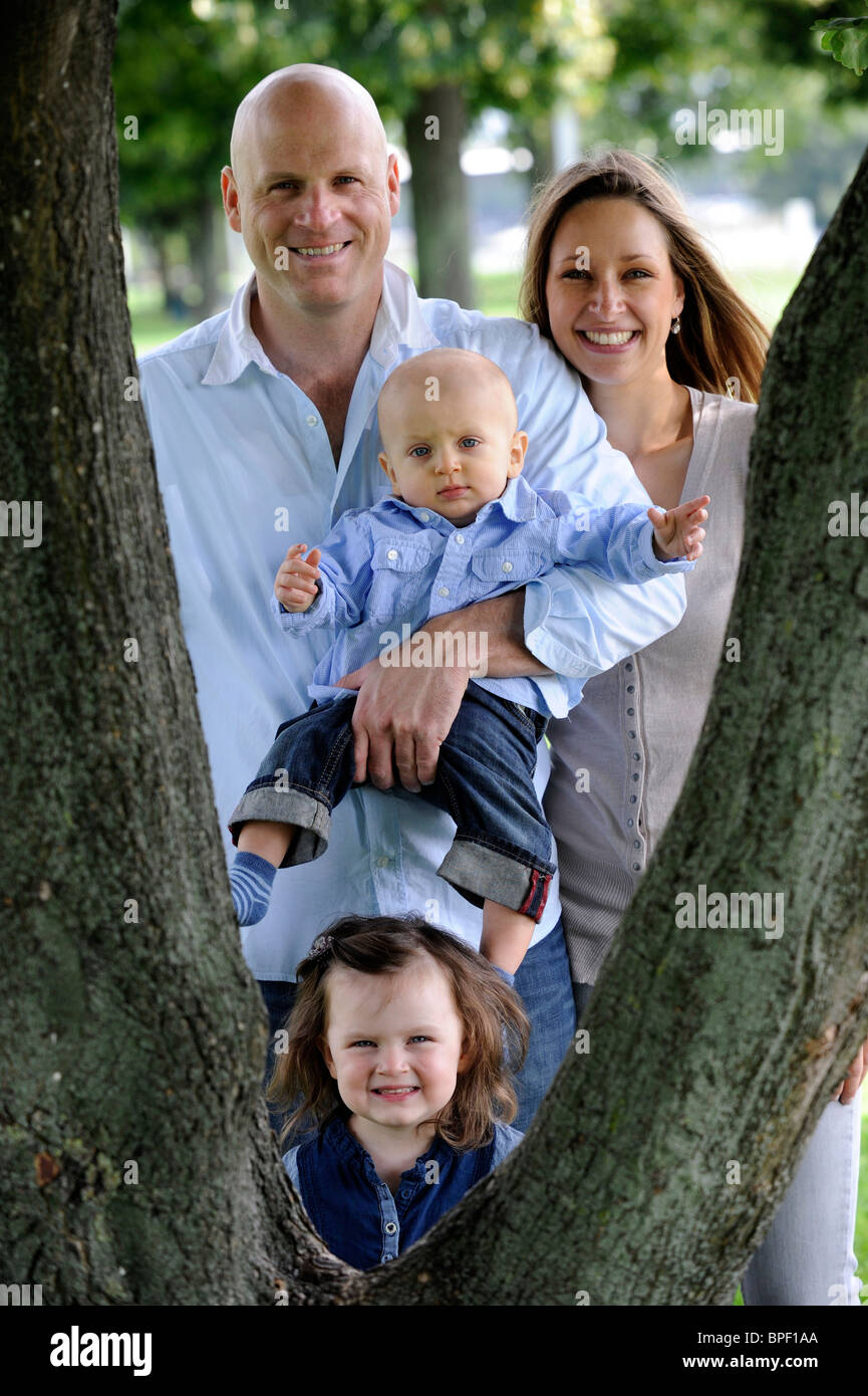 Happy, upper middle class family with two children, a boy and girl ...