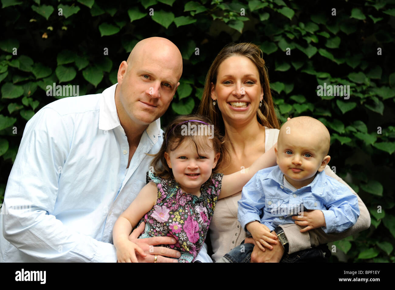 Happy upper middle class family with two children, a boy and girl Stock ...