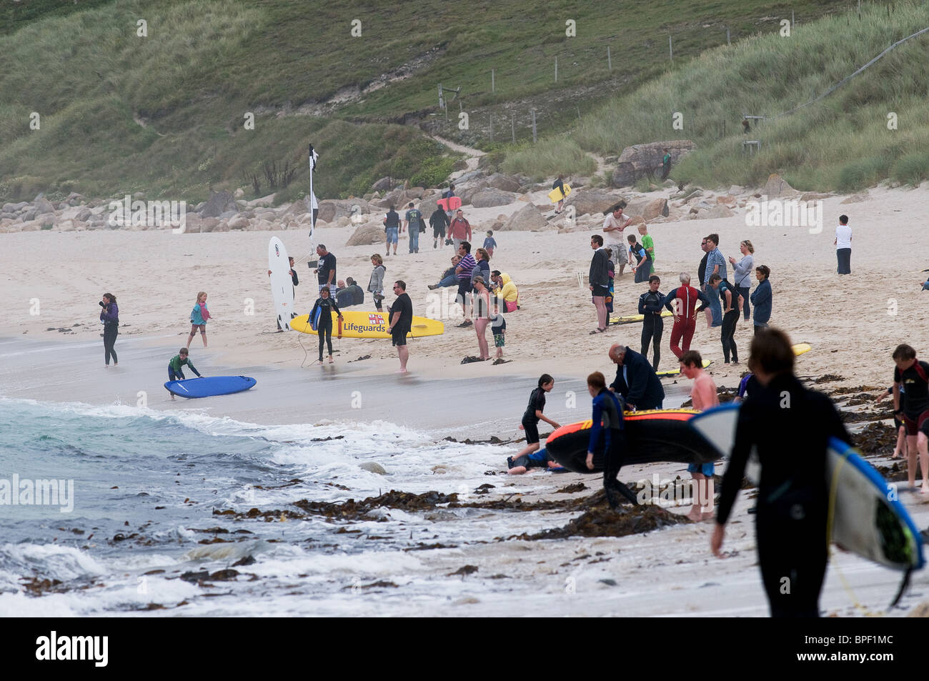 People on Sennen Beach in Cornwall Stock Photo - Alamy