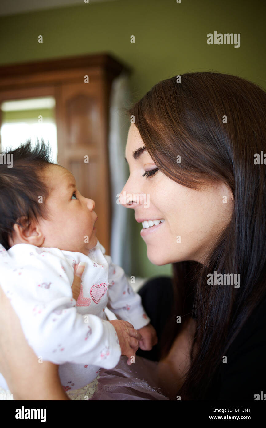 Mother looking at newborn baby Stock Photo - Alamy