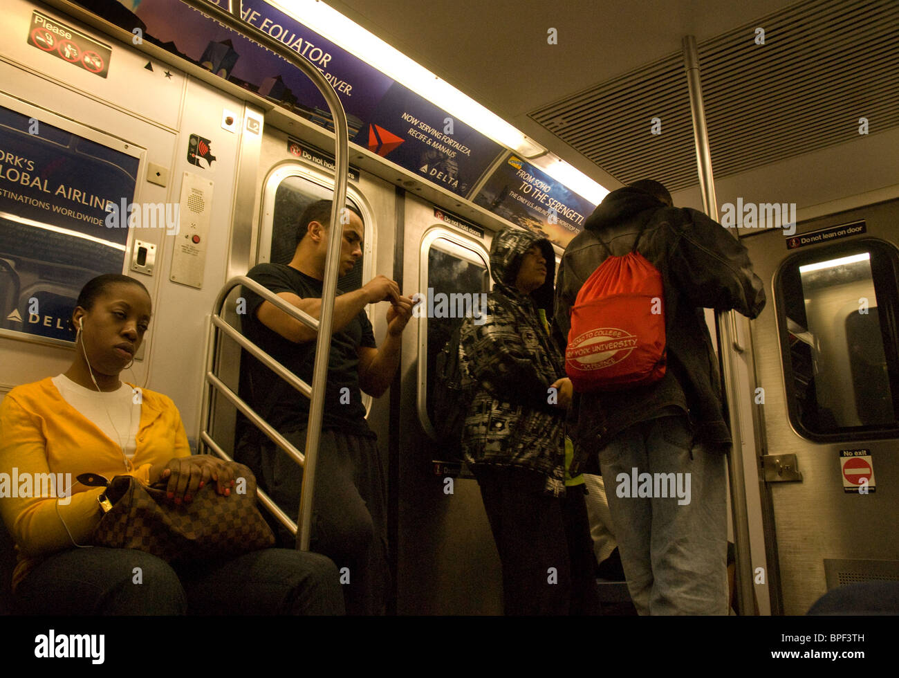 People riding on the New York subway Stock Photo - Alamy