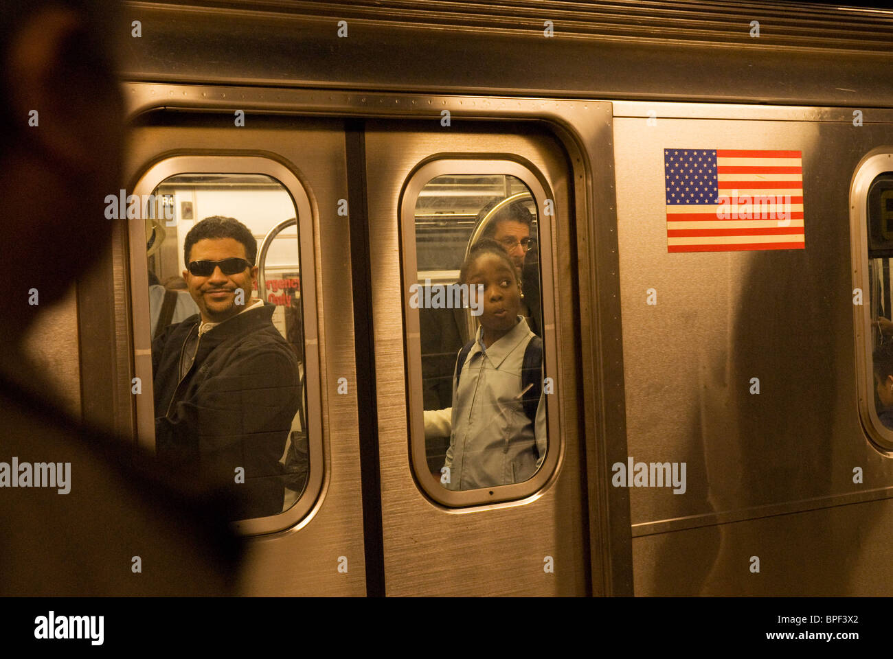 People riding on the New York subway Stock Photo - Alamy