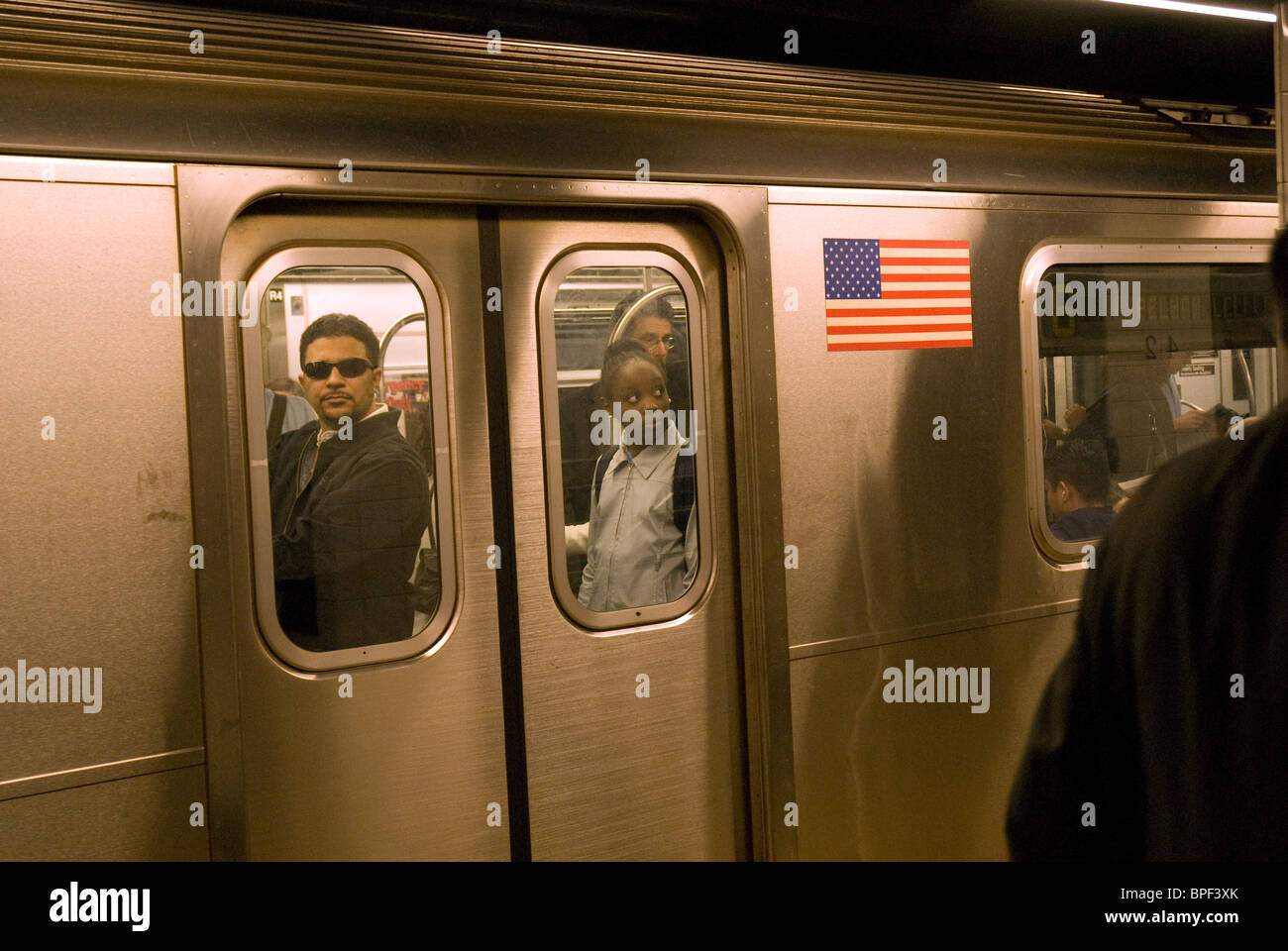 People riding on the New York subway Stock Photo - Alamy