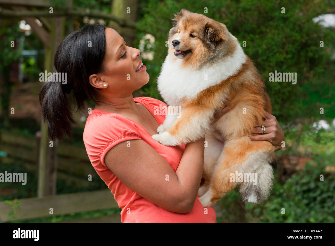 Woman lifting dog one person hi-res stock photography and images - Alamy