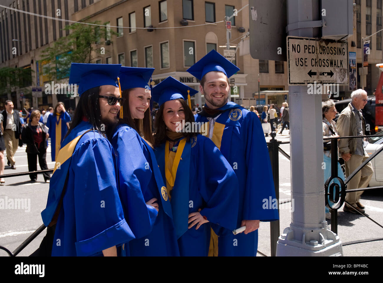 Graduates from Pace University celebrating in New York City following ...