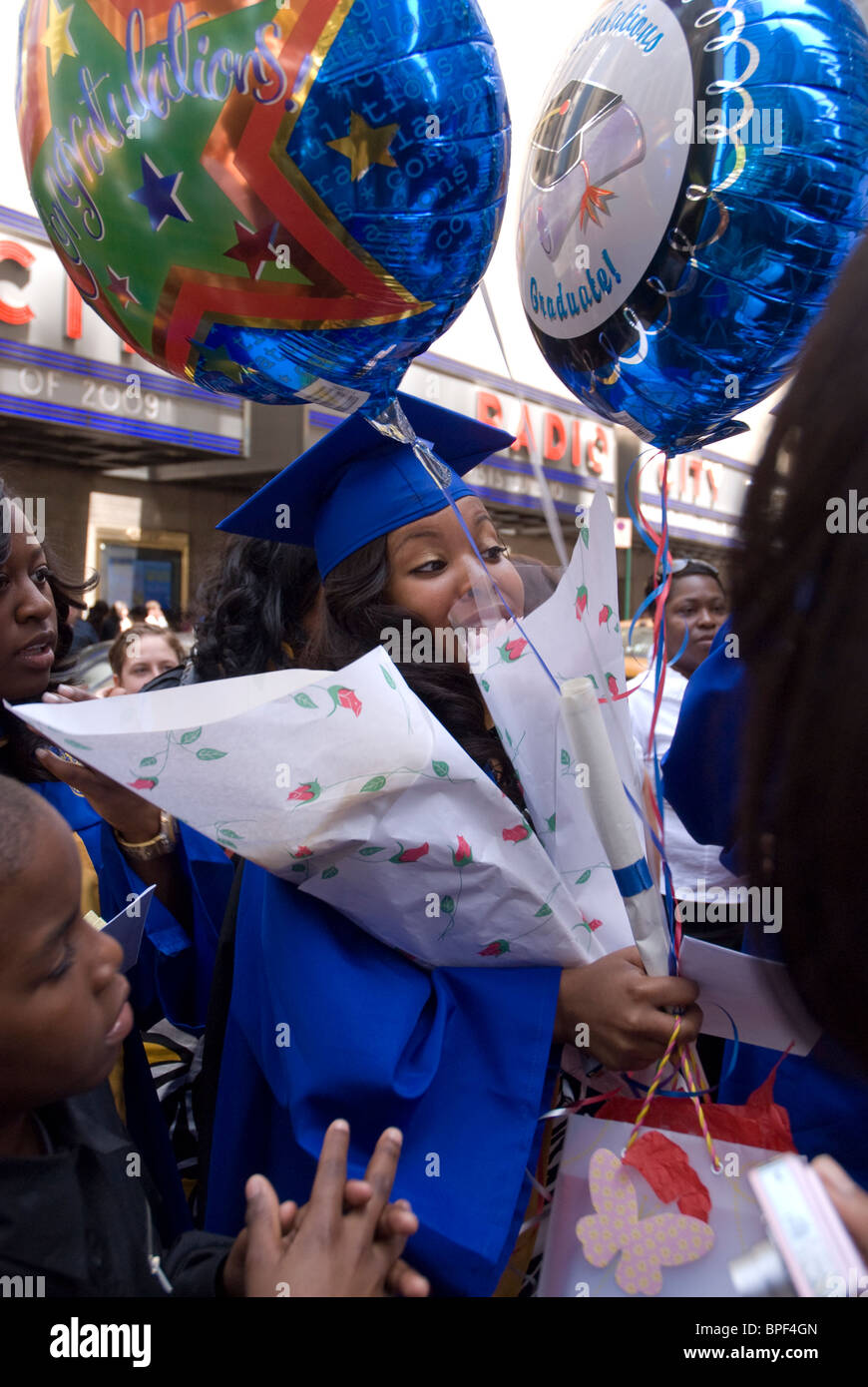 Graduates from Pace University celebrating in New York City following ...