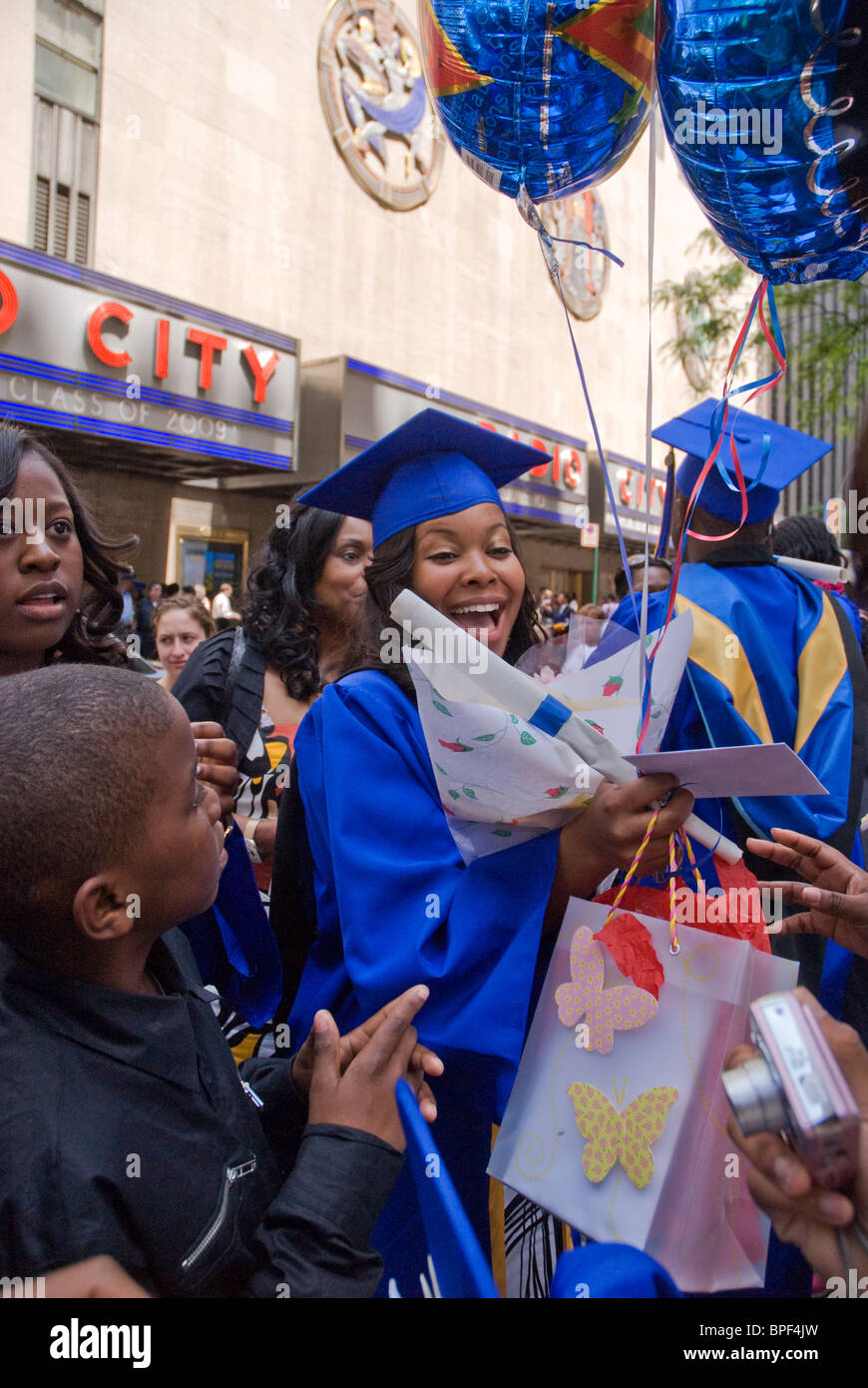 Graduates from Pace University celebrating in New York City following ...