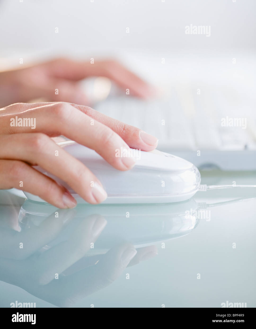 Hands operating computer mouse and keyboard Stock Photo - Alamy