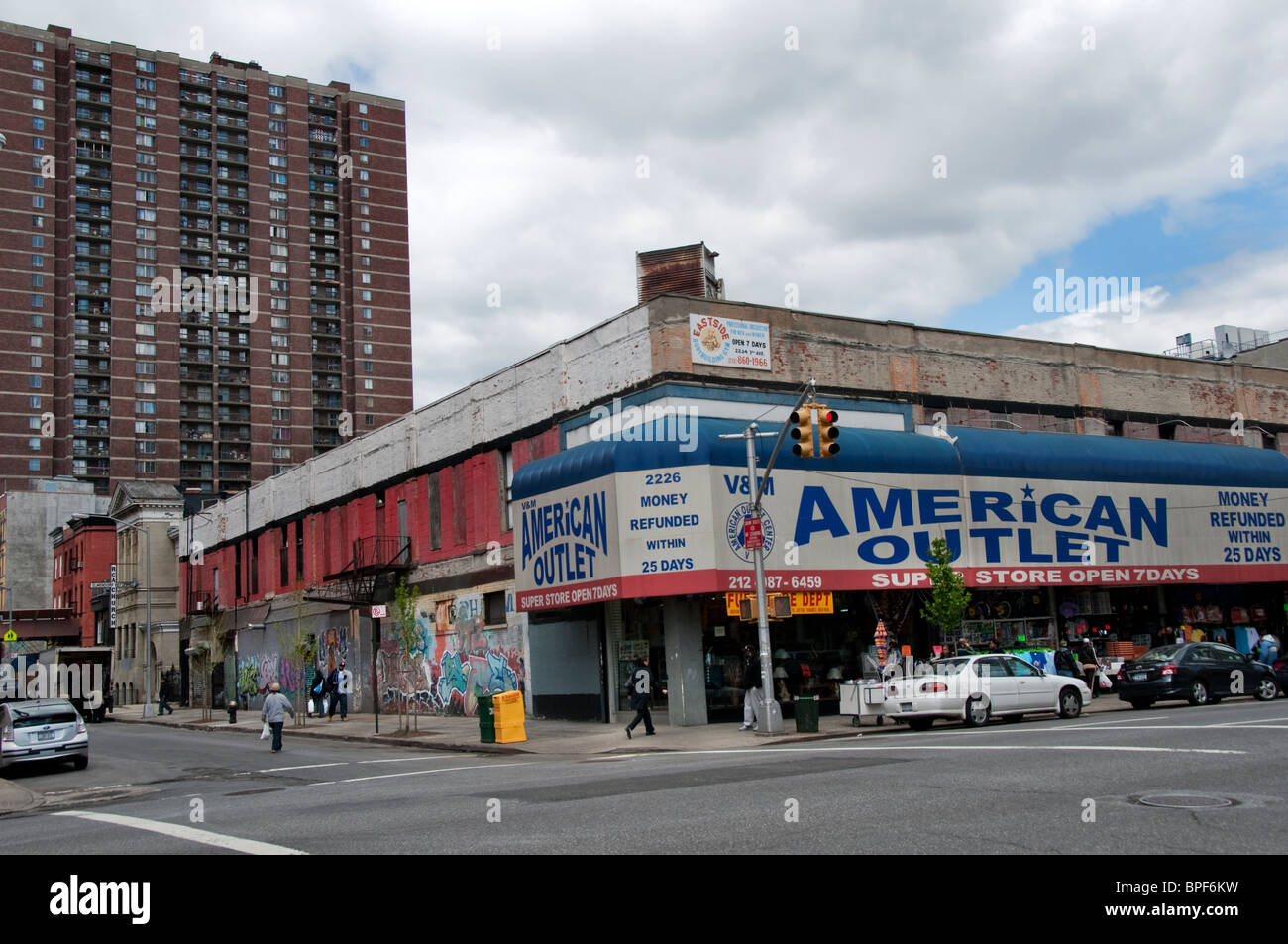 Street corner in East Harlem and Lexingto Avenue with shops and ...