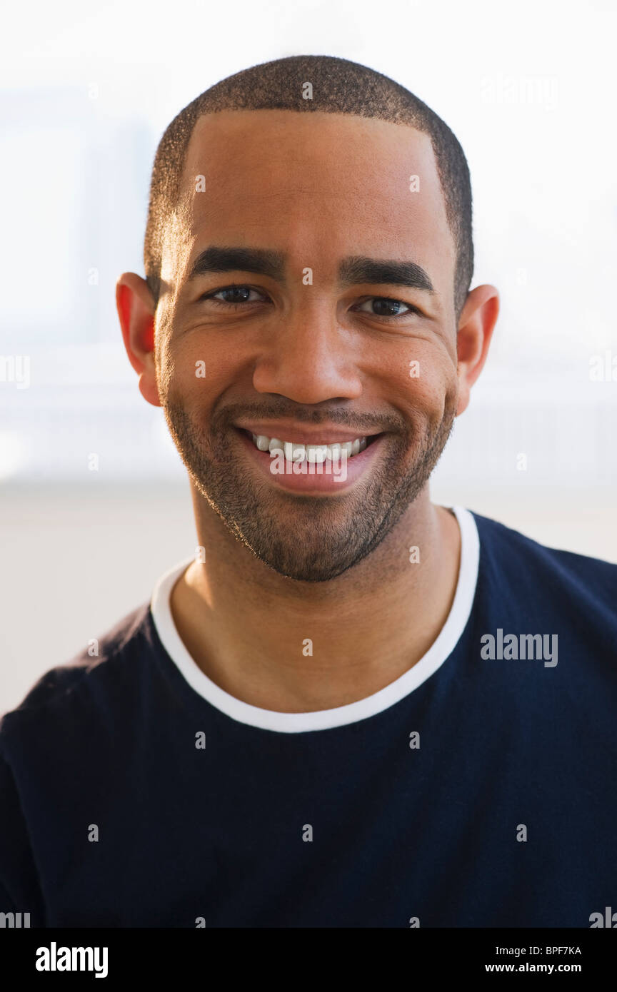 Mixed race man smiling Stock Photo - Alamy