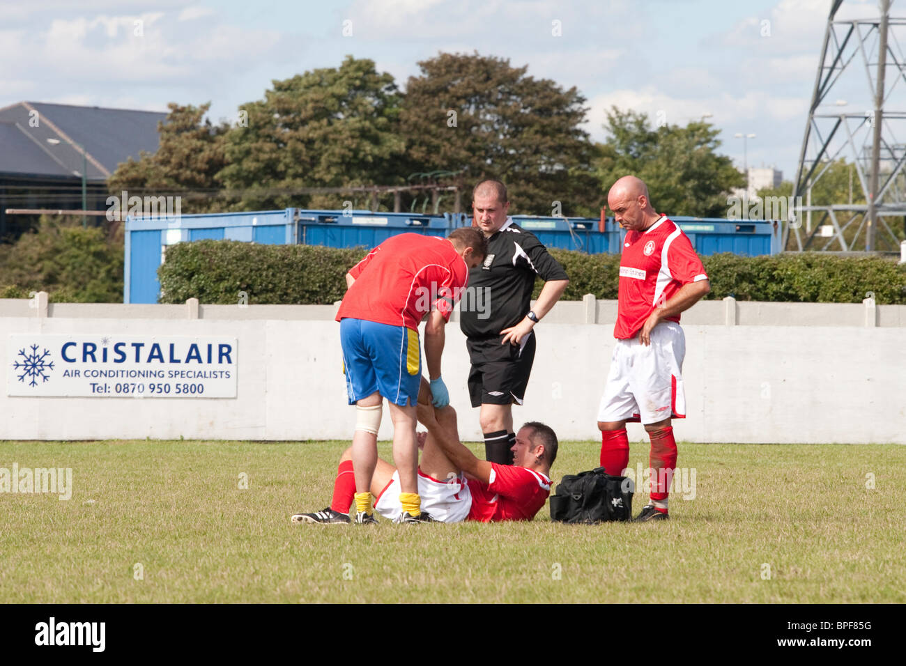 An injured player receiving treatment during a competitive game Stock ...