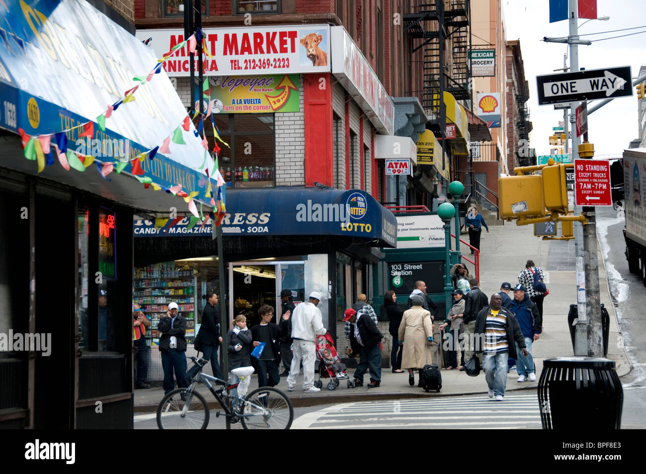 East Harlem street corner with local people of the community Stock ...