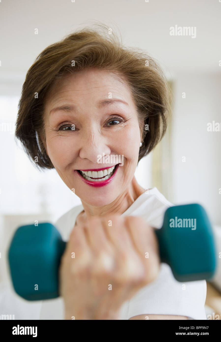 Japanese woman lifting hand weight Stock Photo - Alamy